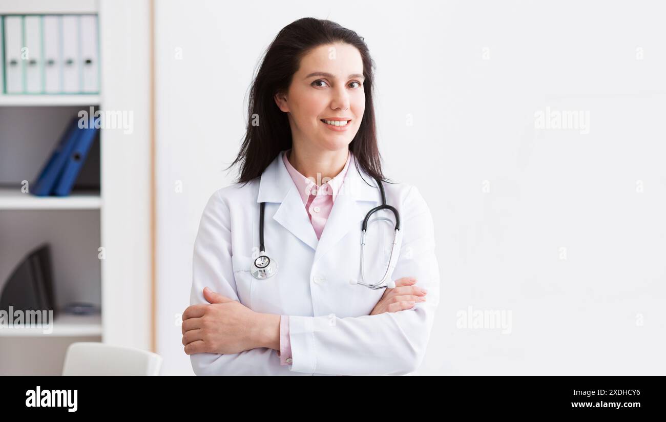 Portrait Of Successful Doctor Posing On Light Background Stock Photo ...