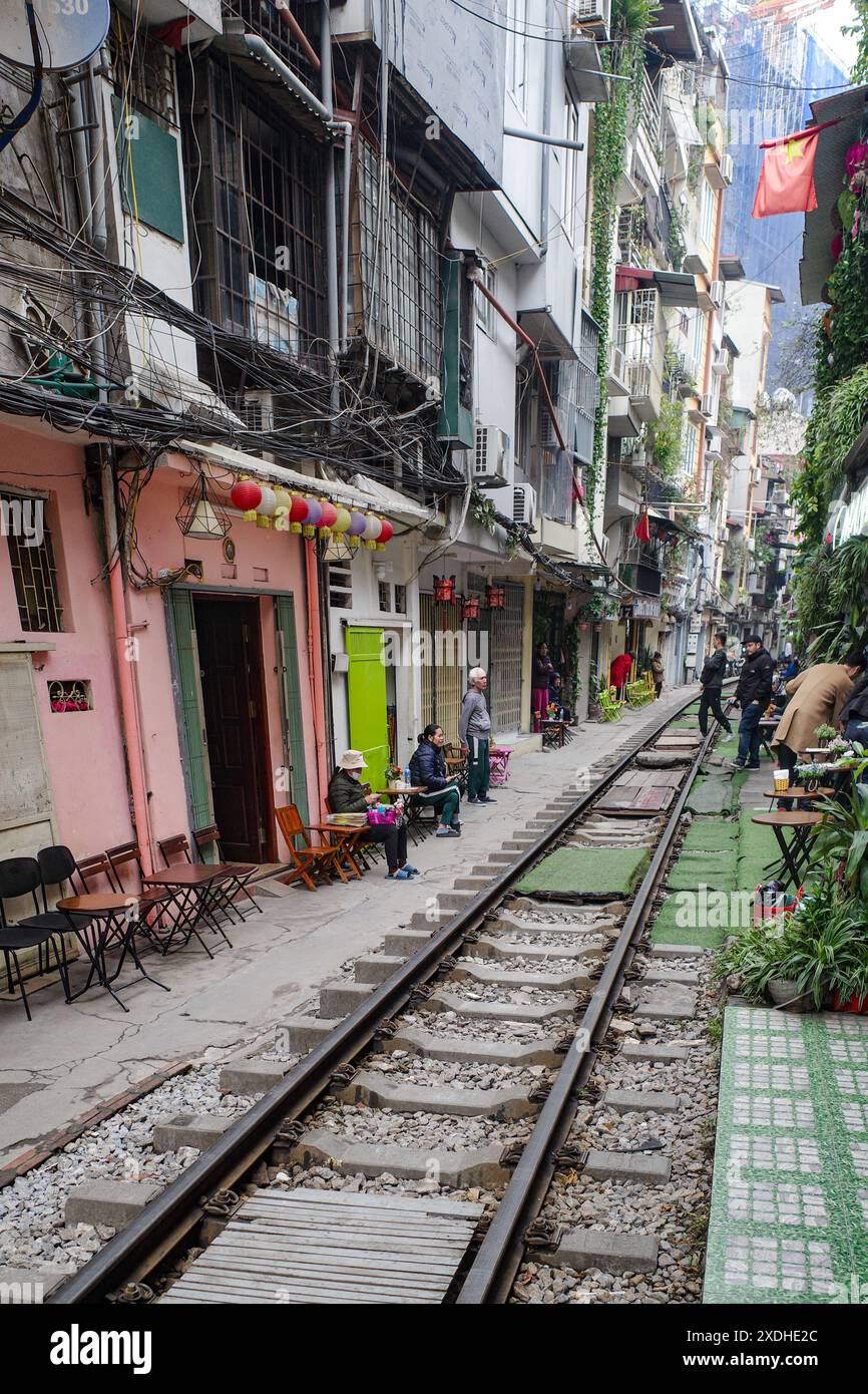 Hanoi, Vietnam - 29 Jan, 2024: Railway tracks run close to houses and ...