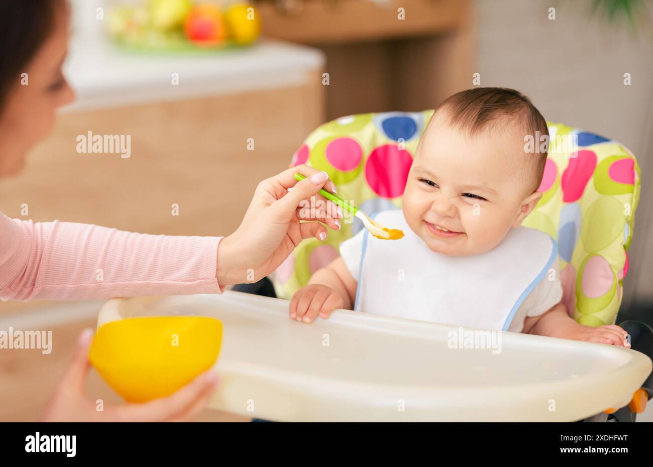 Boy being fed by his mother hi-res stock photography and images - Alamy