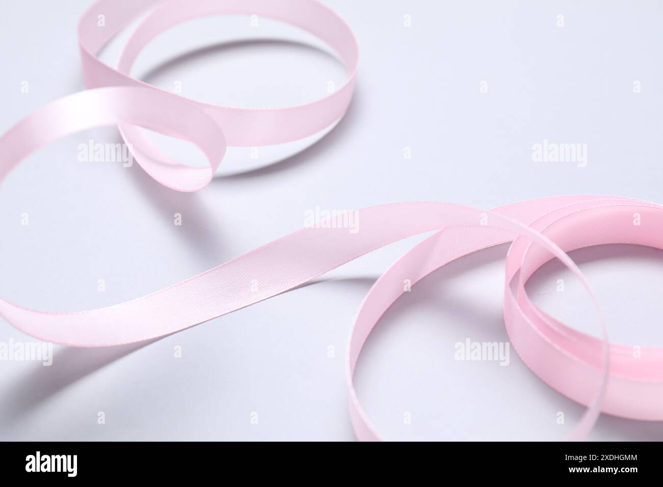 One beautiful pink ribbon on white background Stock Photo - Alamy