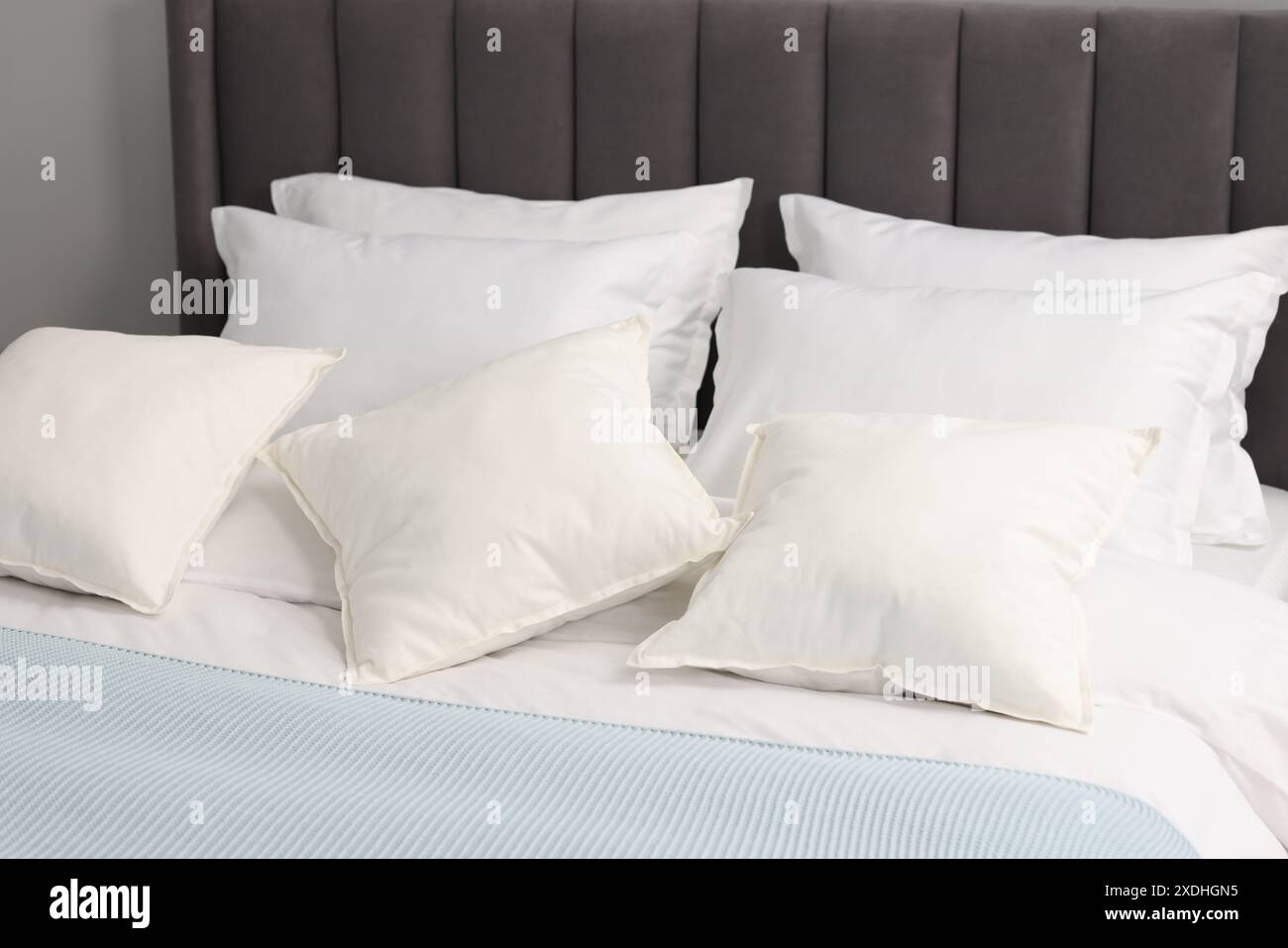 Many soft pillows on bed at home Stock Photo - Alamy