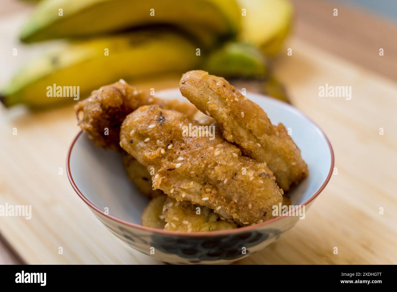 Crispy fried bananas in the small white bowl Stock Photo - Alamy
