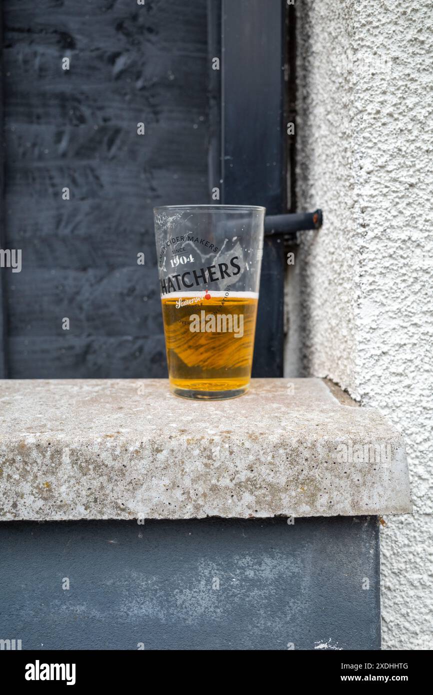 Clear plastic cup containing Thatchers cider Stock Photo - Alamy