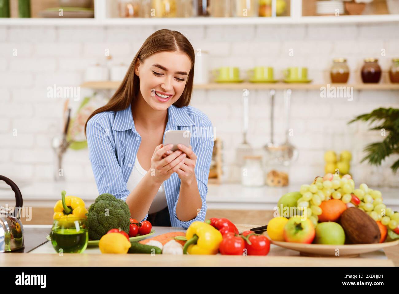 Young woman touching fruits hi-res stock photography and images - Alamy