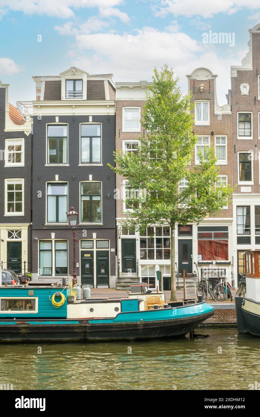 Netherlands. Summer day in Amsterdam. Typical Dutch houses and bicycles ...