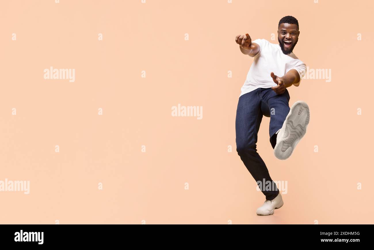 Happy african black man dancing hi-res stock photography and images - Alamy