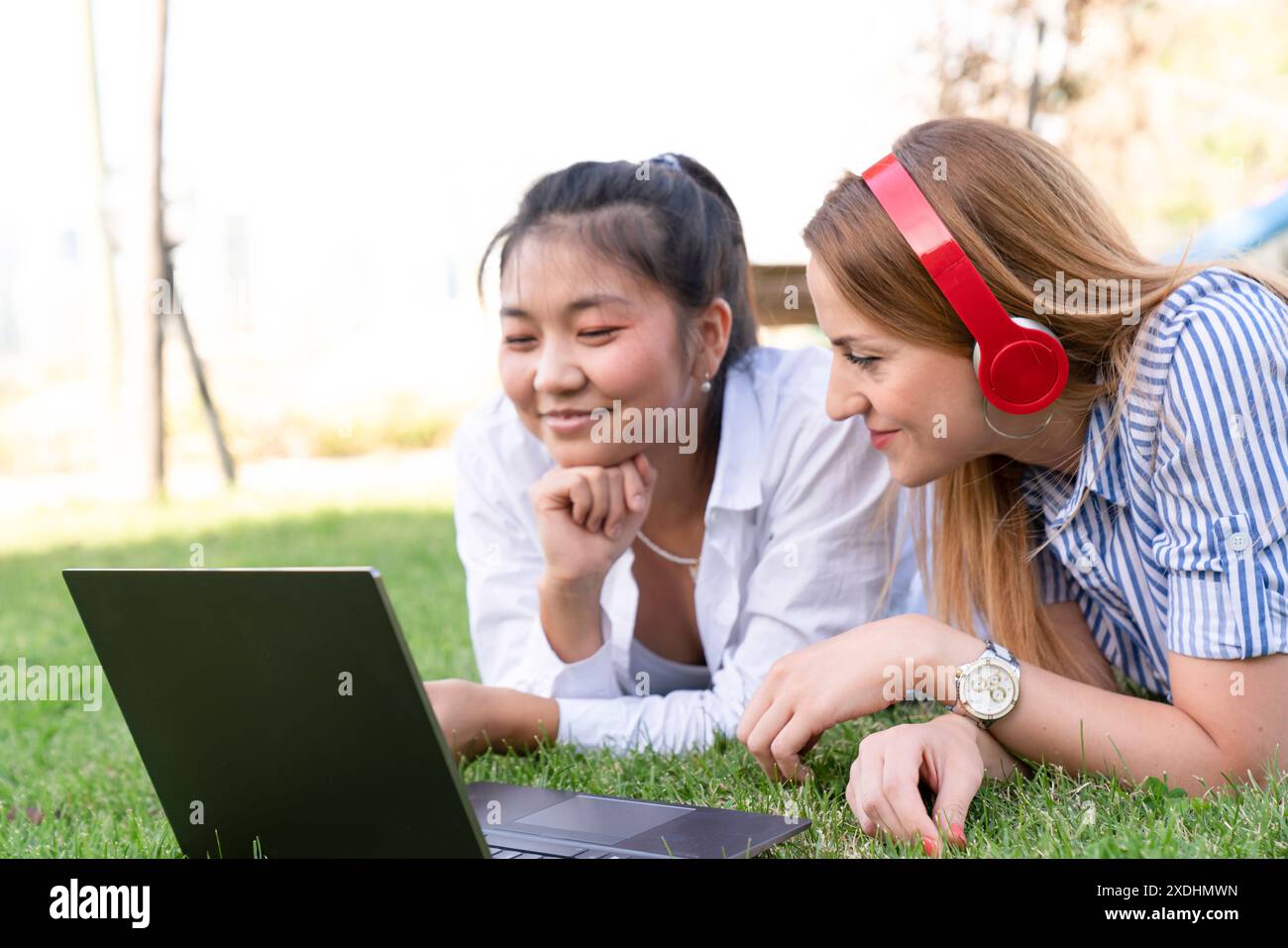 Happy young multiethnic couple spending time together at the park ...