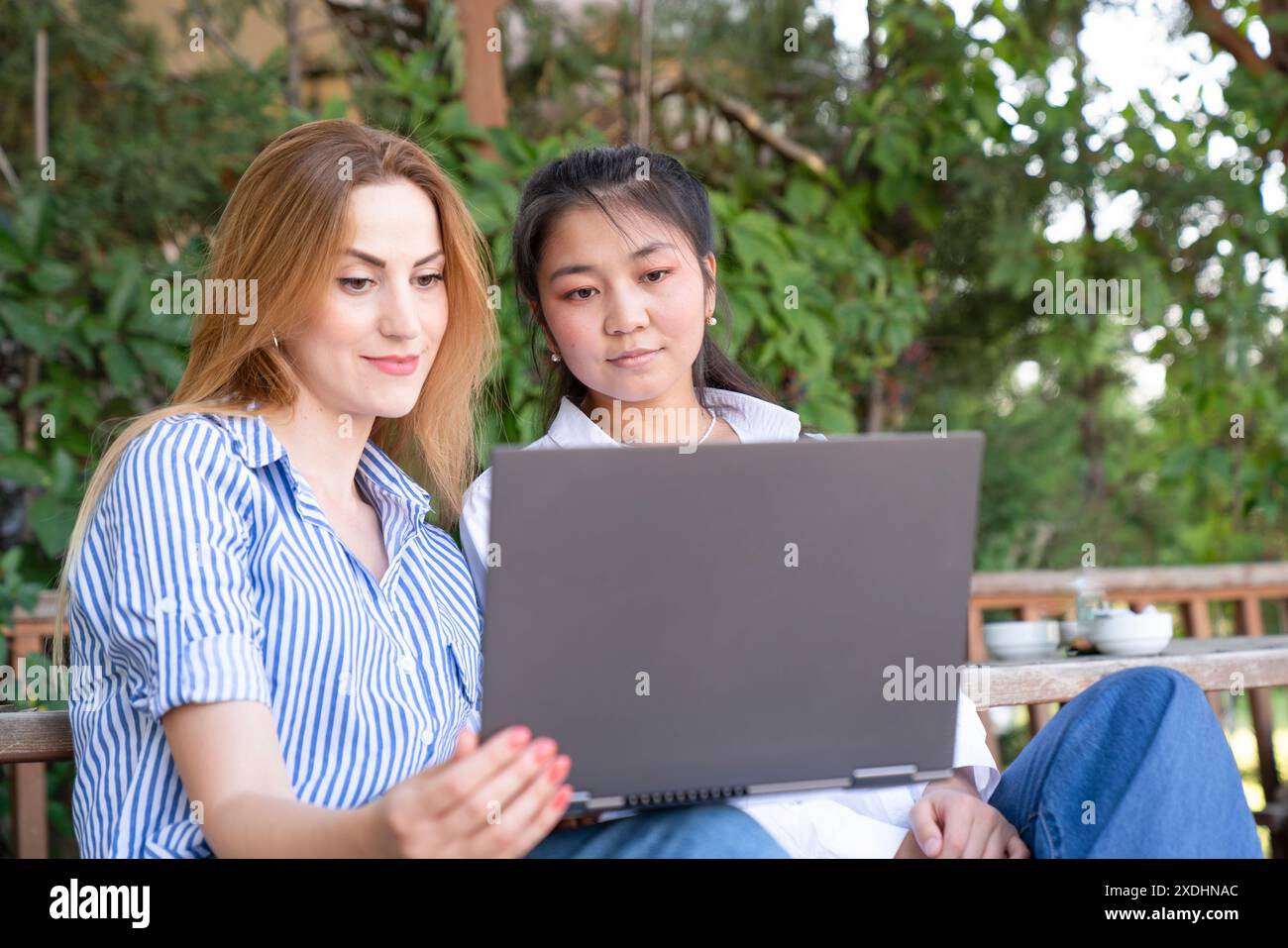 Happy young multiethnic couple spending time together at the park ...