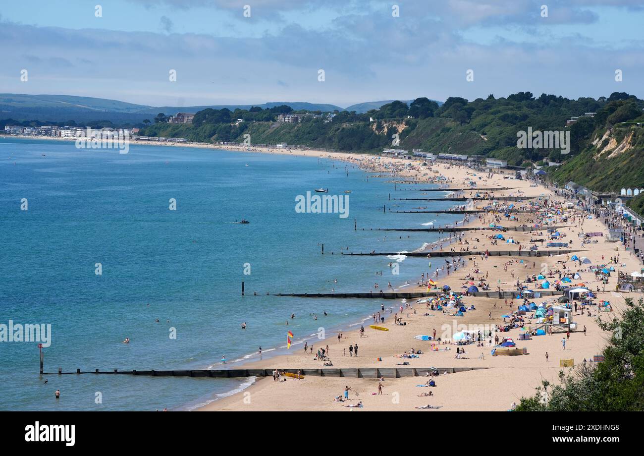People enjoying the sunny weather on Durley Chine Beach in Dorset ...