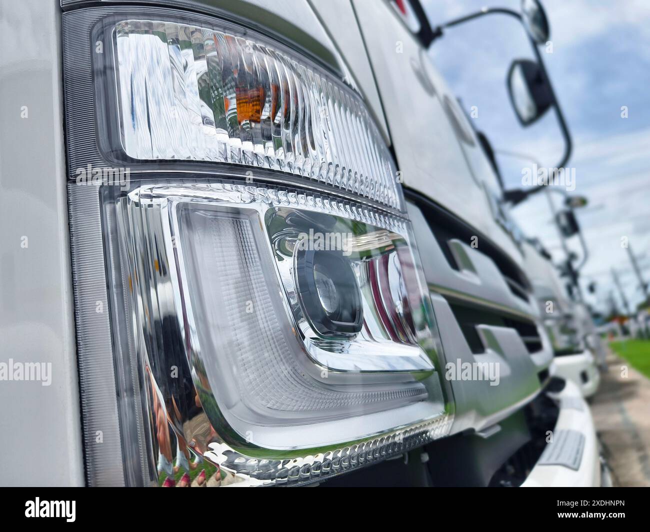 Big truck headlight with grille and hood Stock Photo - Alamy