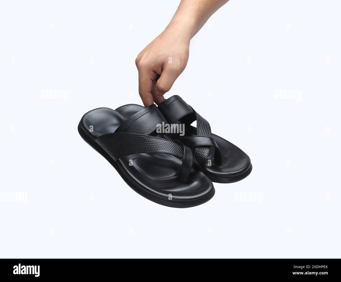 mens leather sandals hold in the hand isolated on white background ...