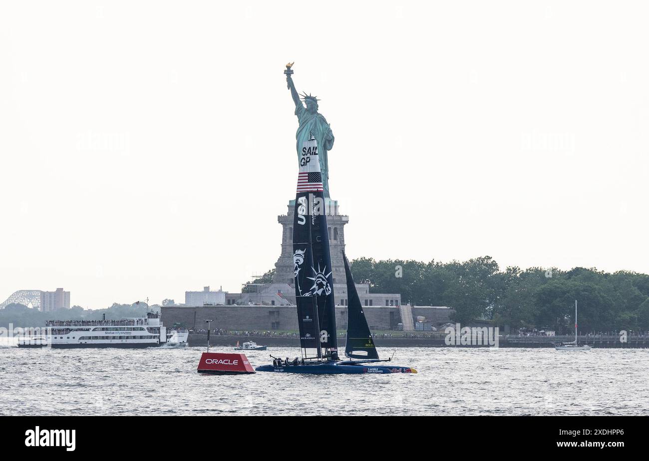 USA boat races during SailGP first day in New York harbor with Statue ...