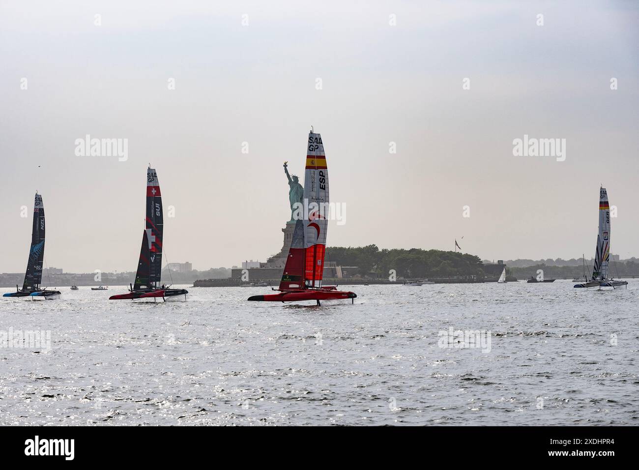Boats races during SailGP first day in New York harbor with Statue of ...