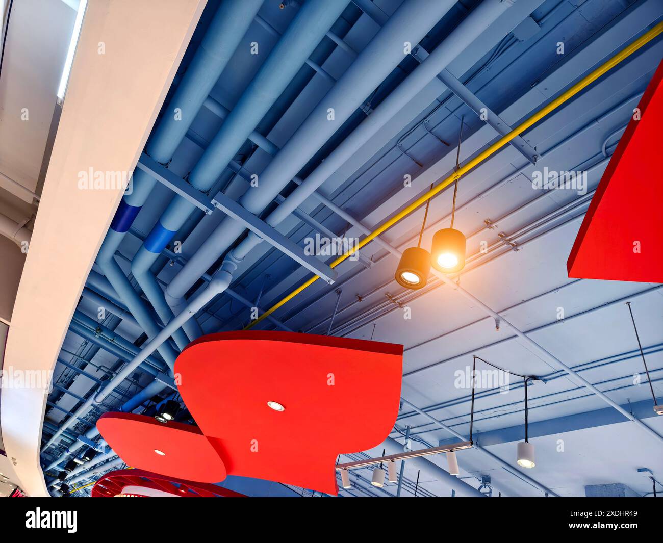 Ceiling with pipes and lights in creates industrial a pattern Stock ...
