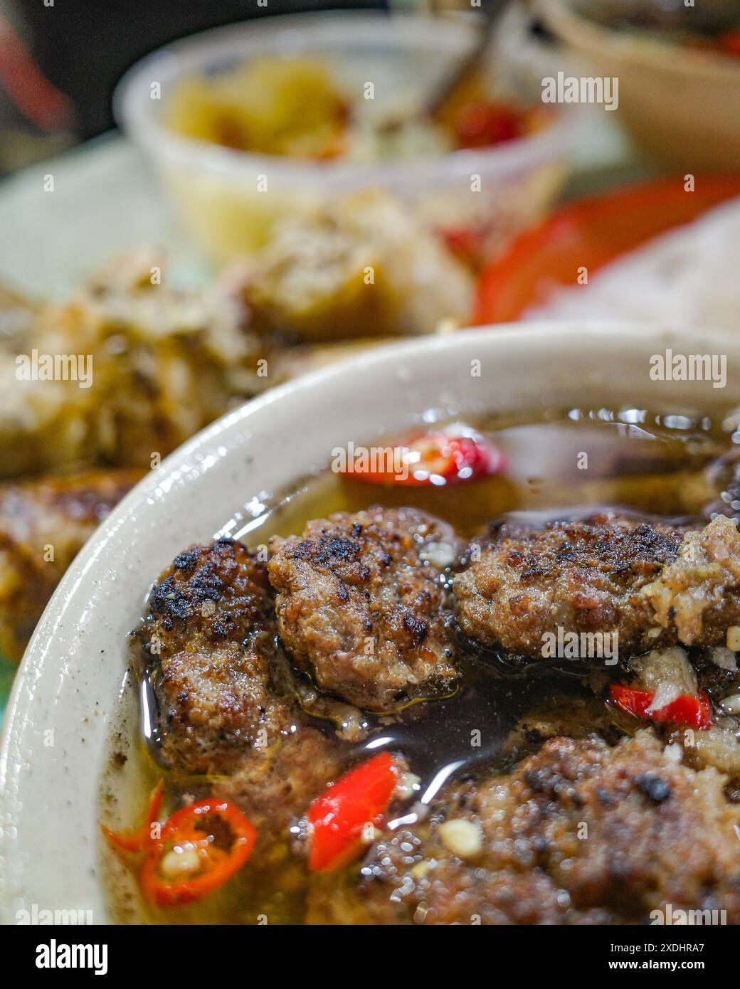 Hanoi, Vietnam - 9 Feb, 2024: Bun Cha, a traditional Vietnamese vermicelli soup dish made with ...