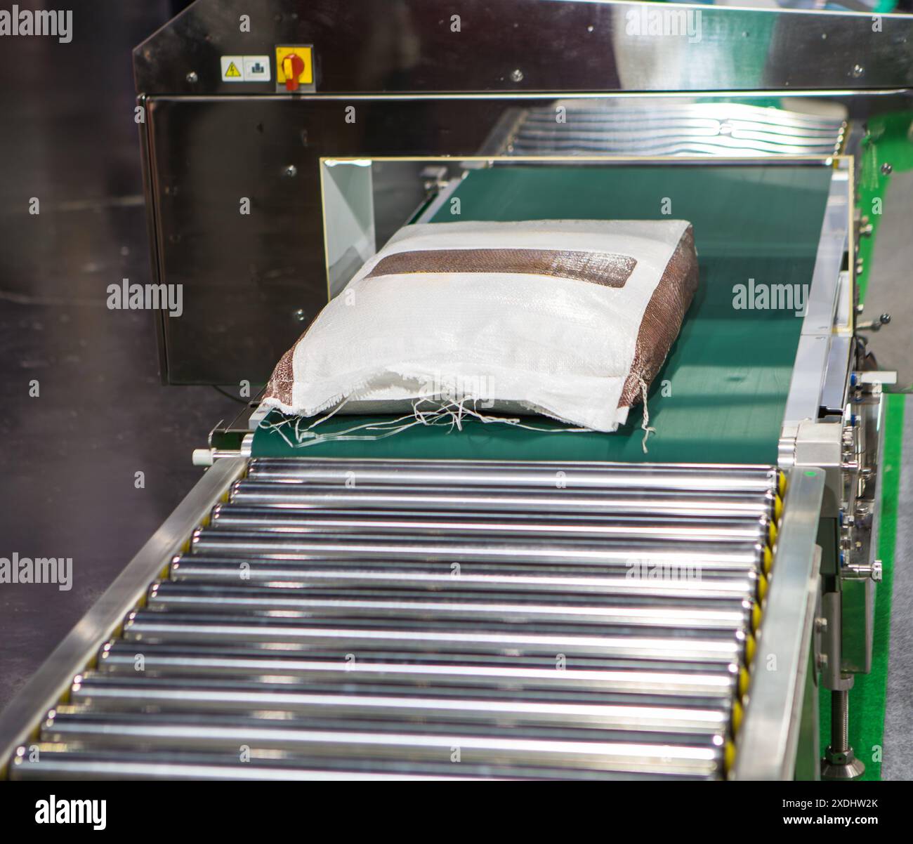 Woven rice package sack bag on conveyor belt in warehouse Stock Photo ...