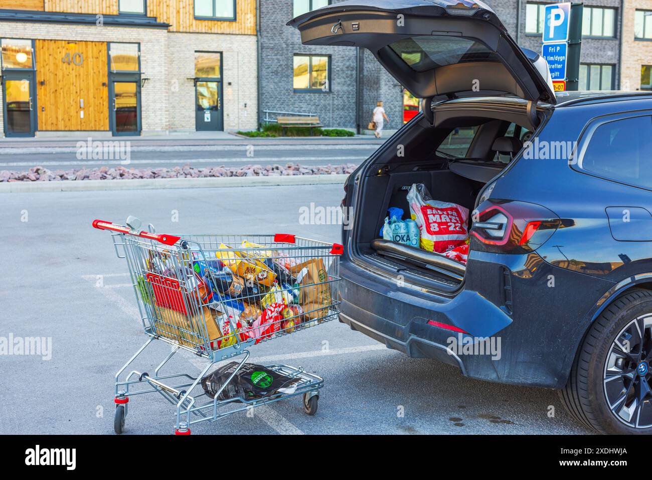 Loading groceries electric car hi-res stock photography and images - Alamy