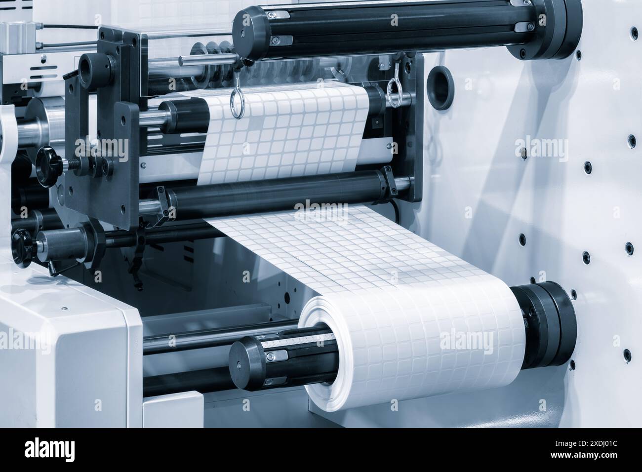 A roll of white paper is passed through the machine. printer and ...