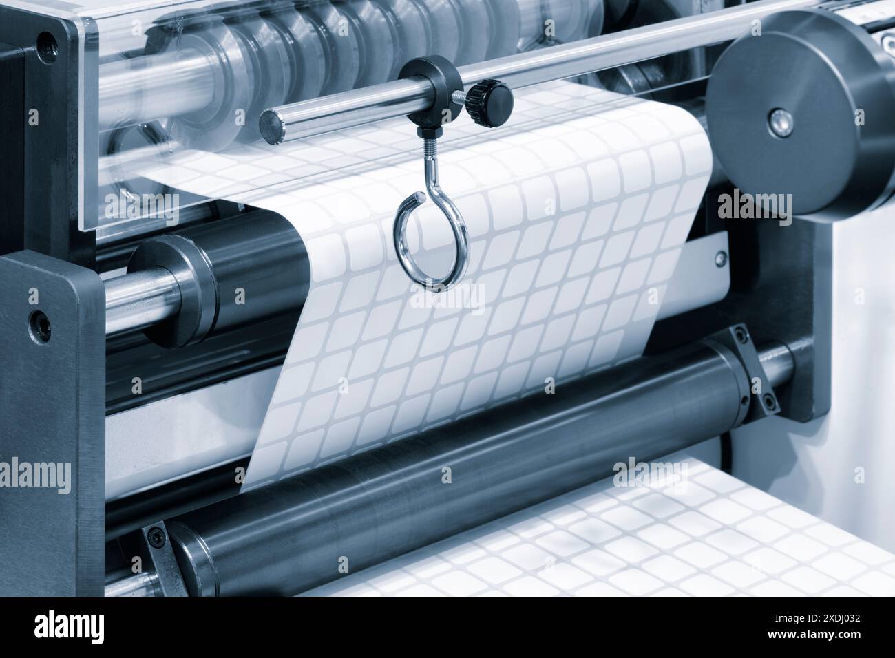 A roll of white paper is passed through the machine. printer and ...