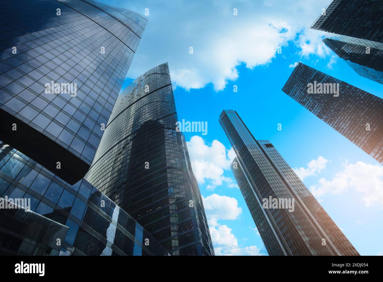 Tall office skyscrapers with sky reflection in windows, business ...