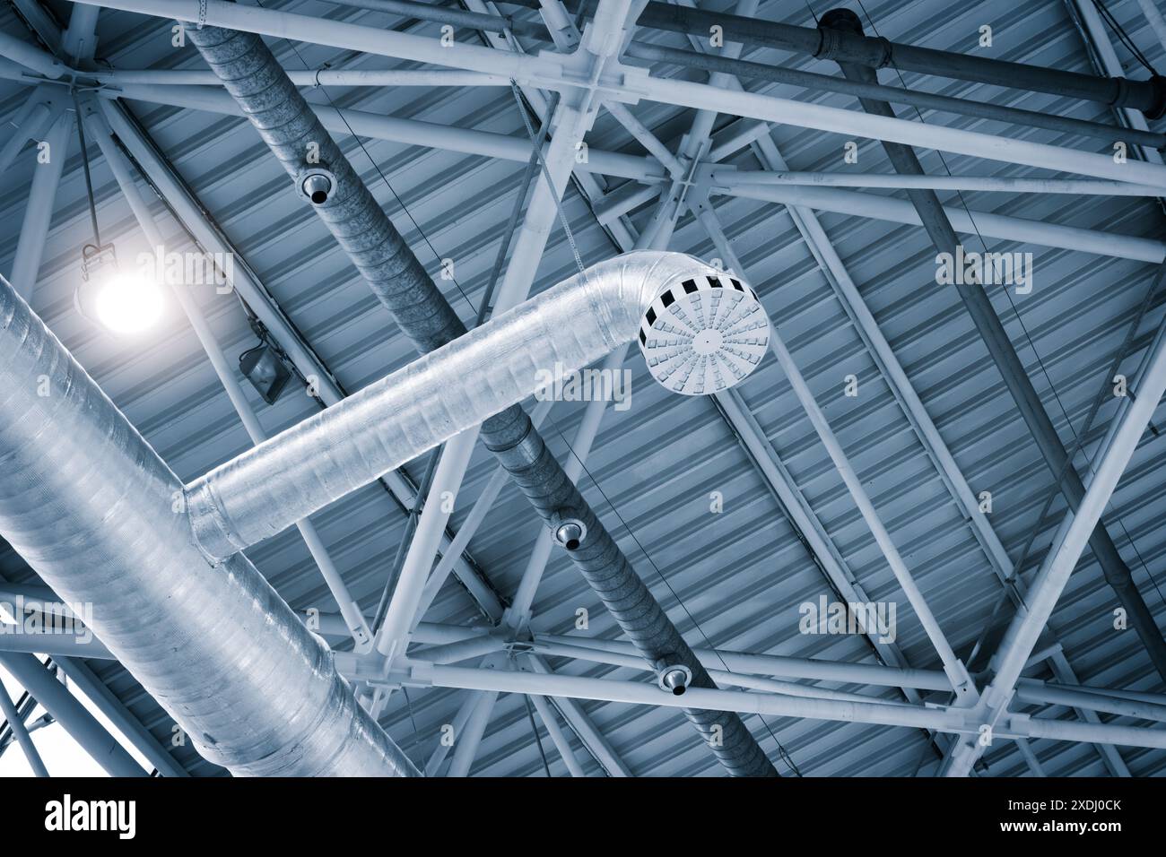 Ventilation pipes in silver insulation material hanging from the ...