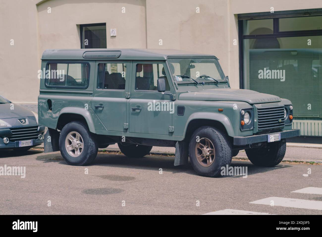 Cremona, Italy - June 21st 2024 Land Rover Defender Green suv parked on ...