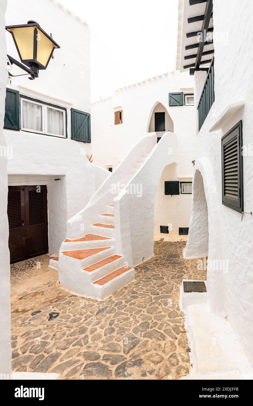 The beautiful town of Binibeca on Menorca. Narrow streets and white ...