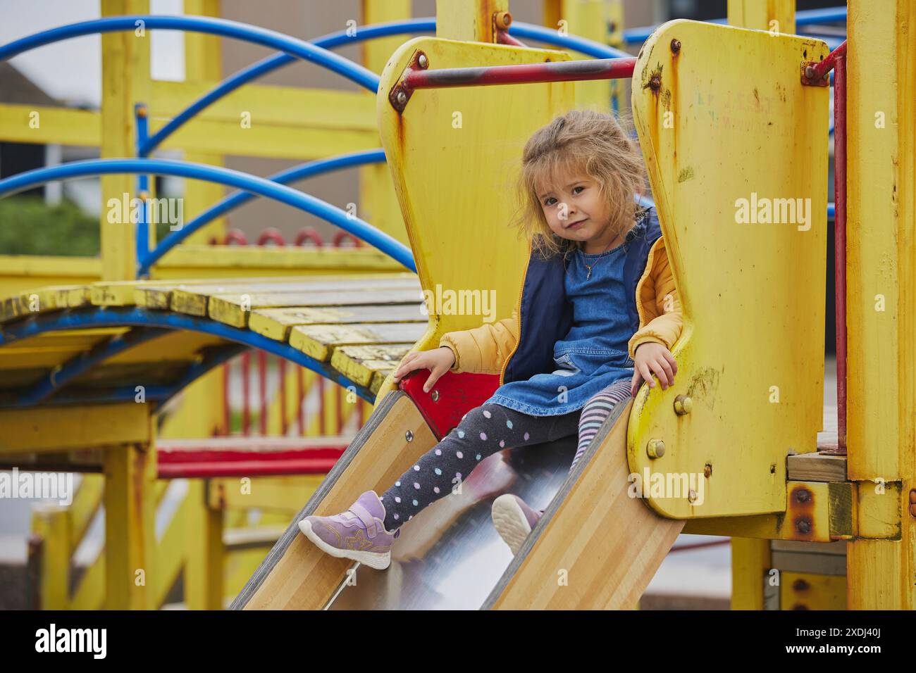 Charming child playing on a playground in Denmark Stock Photo - Alamy