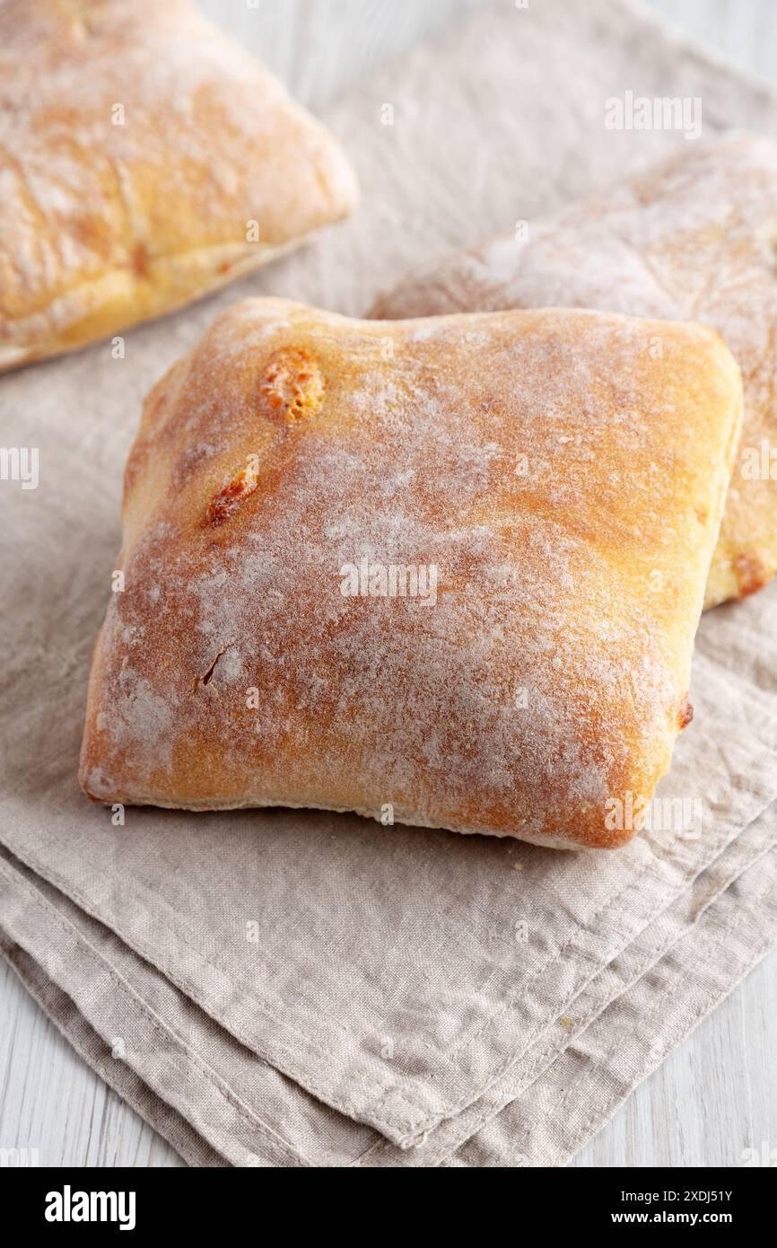 Homemade Cheese Ciabatta Buns on a white wooden background, side view ...