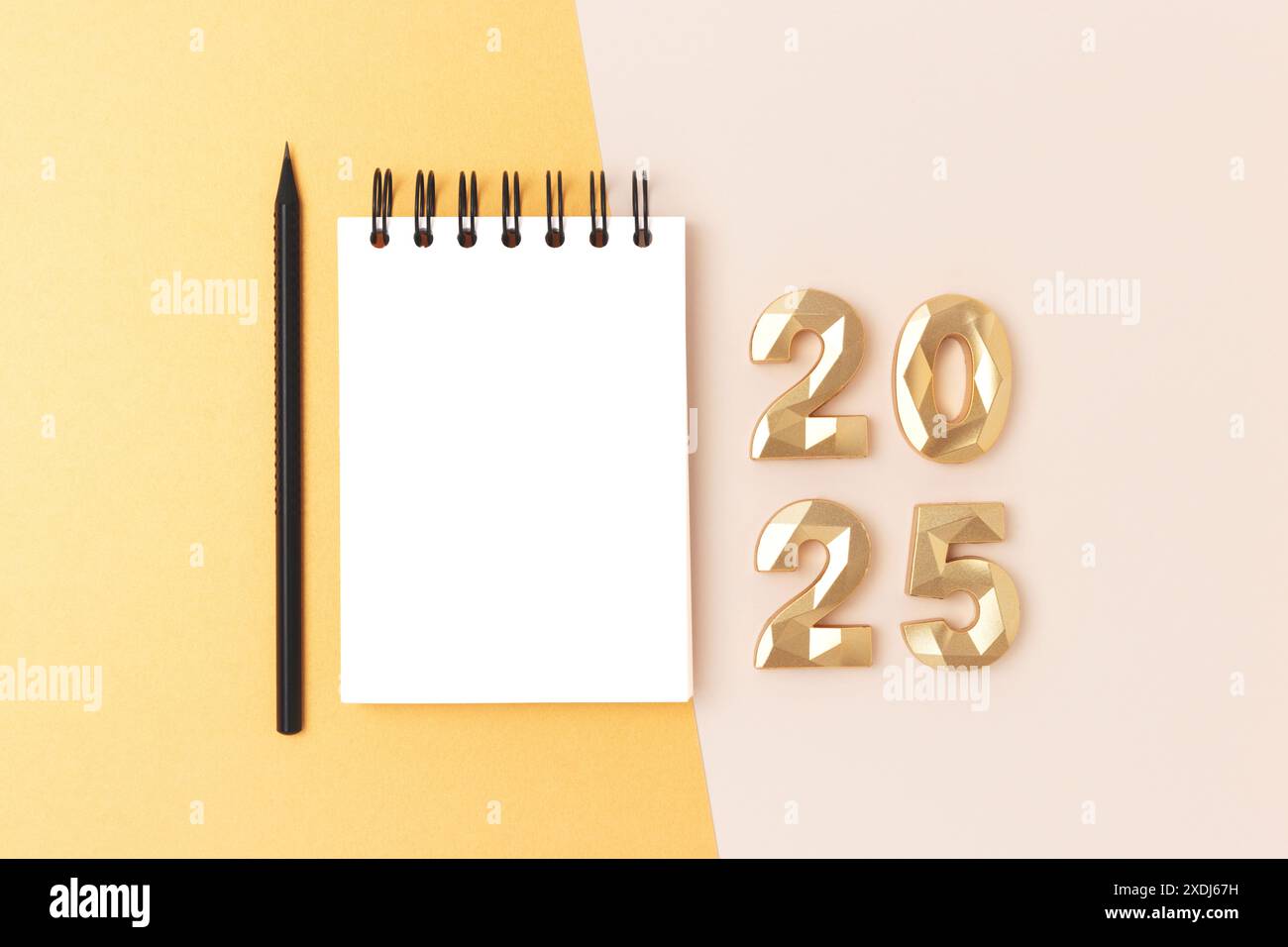 2025 New Year concept with copy space. Blank notepad mockup, pencil and ...