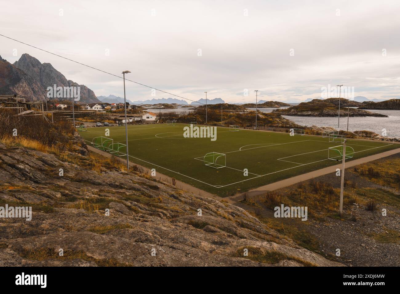 View over the Henningsvaer football stadium in Norway with the sea and ...