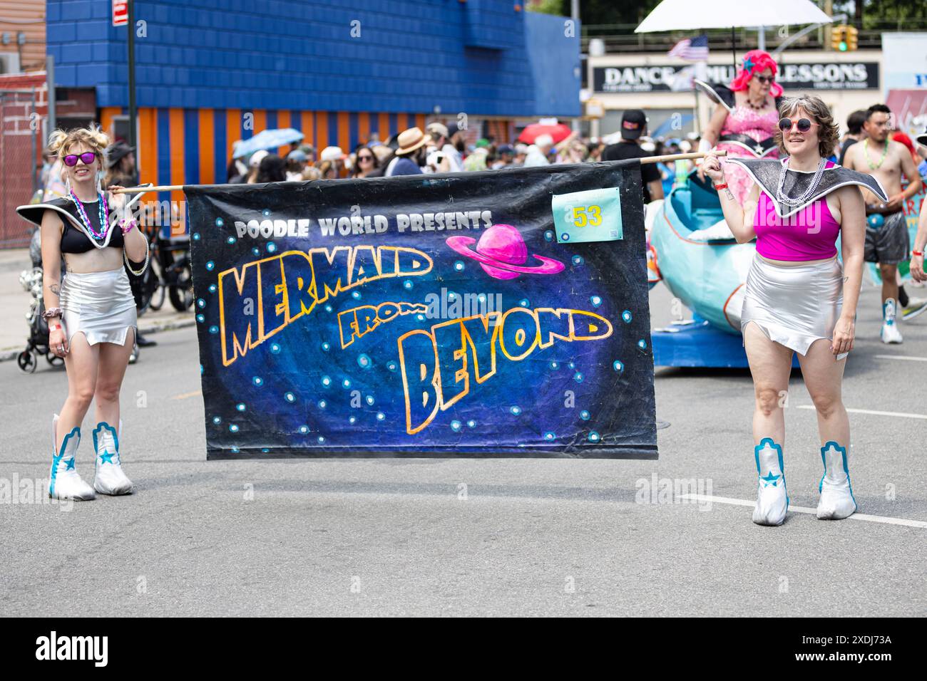 Members of Poodle World march in the 42nd Annual Mermaid Parade at ...