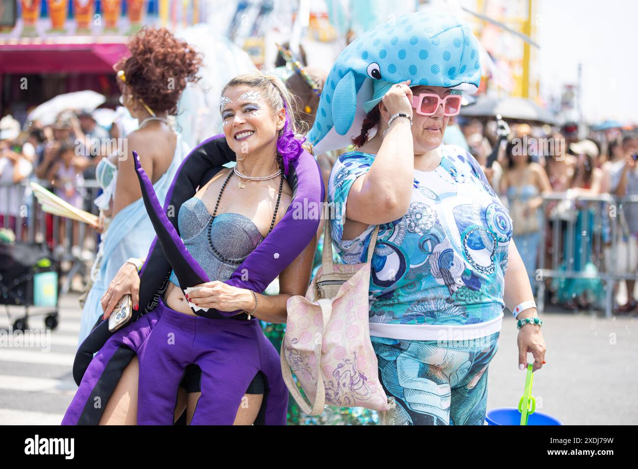 Participants of the 42nd Annual Mermaid Parade pose for a photo at ...