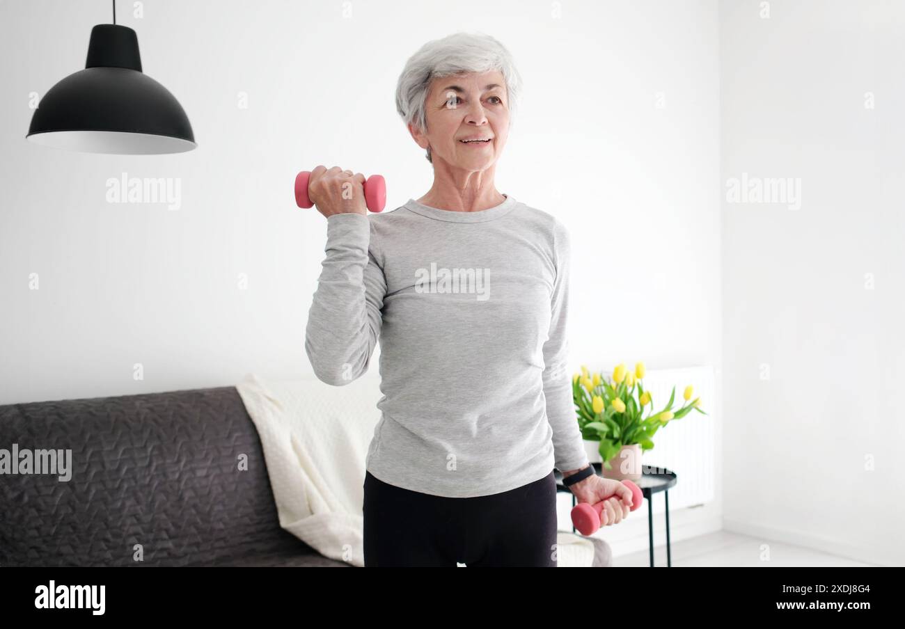 Elderly Woman With Grey Hair, Attractive And Active, Doing Fitness ...