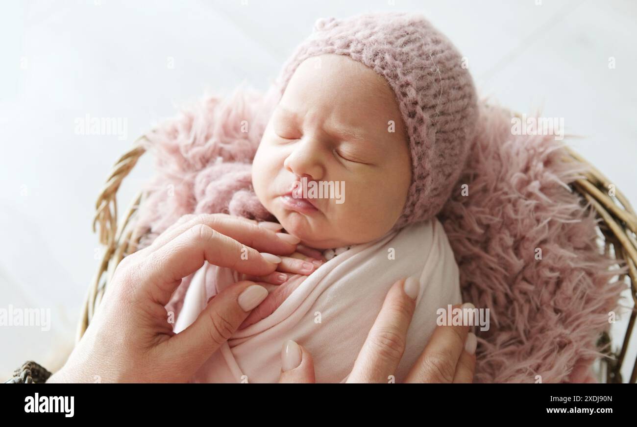 Professional Photographer Calming A Newborn Baby For A Photo Shoot ...