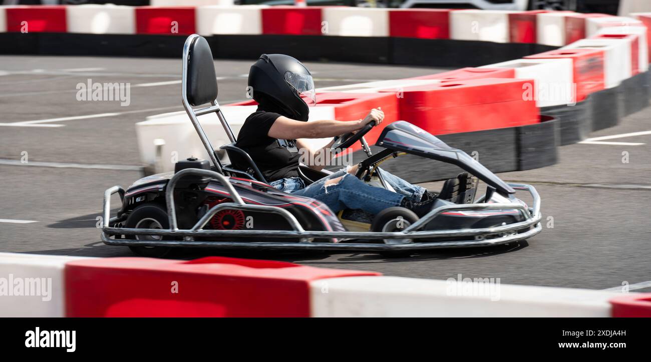 Girl In Protective Helmet Driving Go-Kart By Extreme Racing Track Stock ...