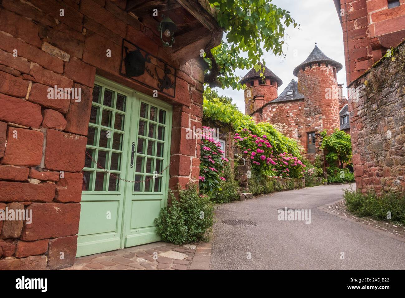 Red houses seen from the street in Collonges-la-Rouge, one of the most ...