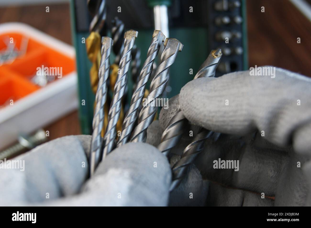 Selection of drills before starting work. Builder's work process Stock ...