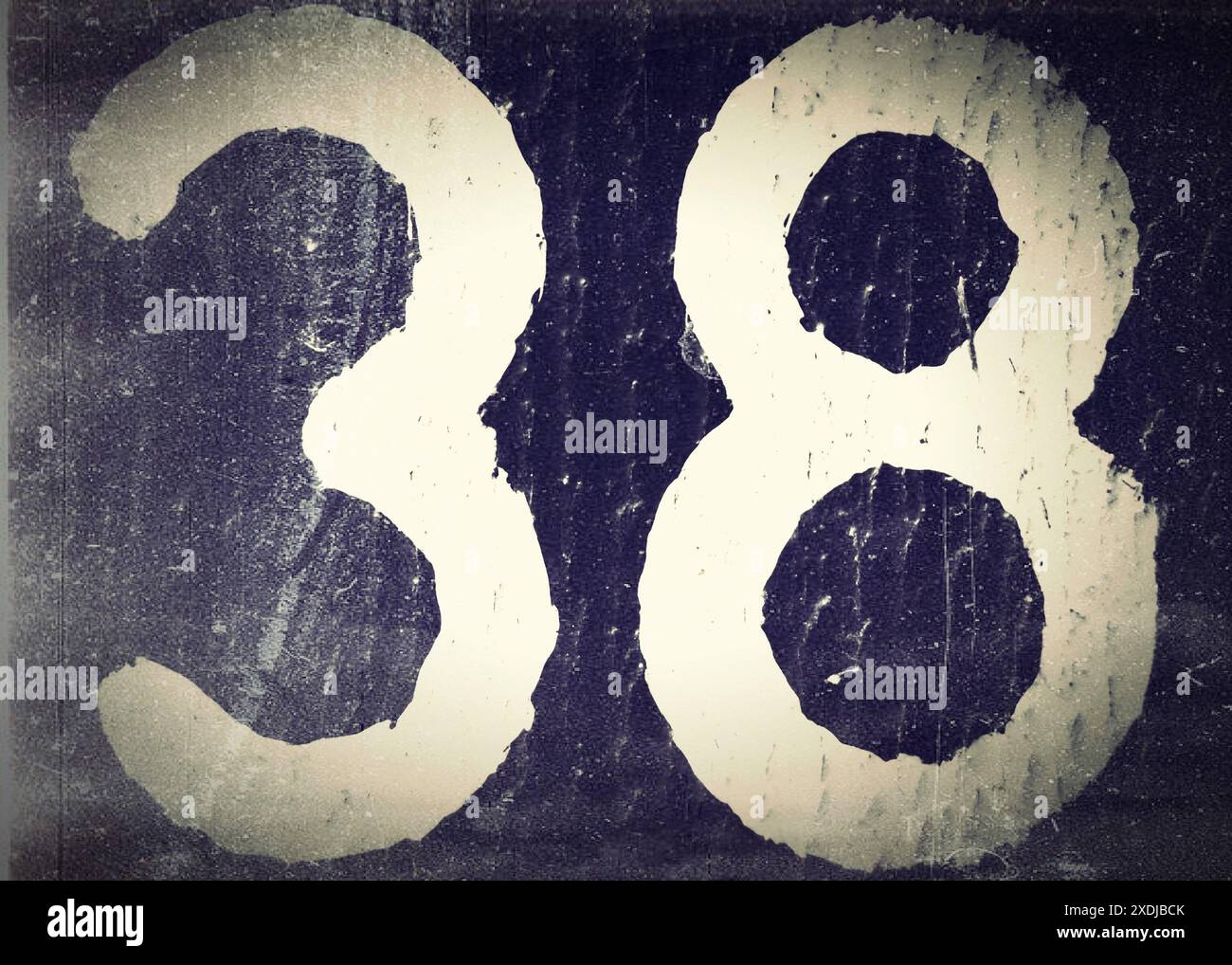 Number 38, White number on a dark background. Black and white old photo ...