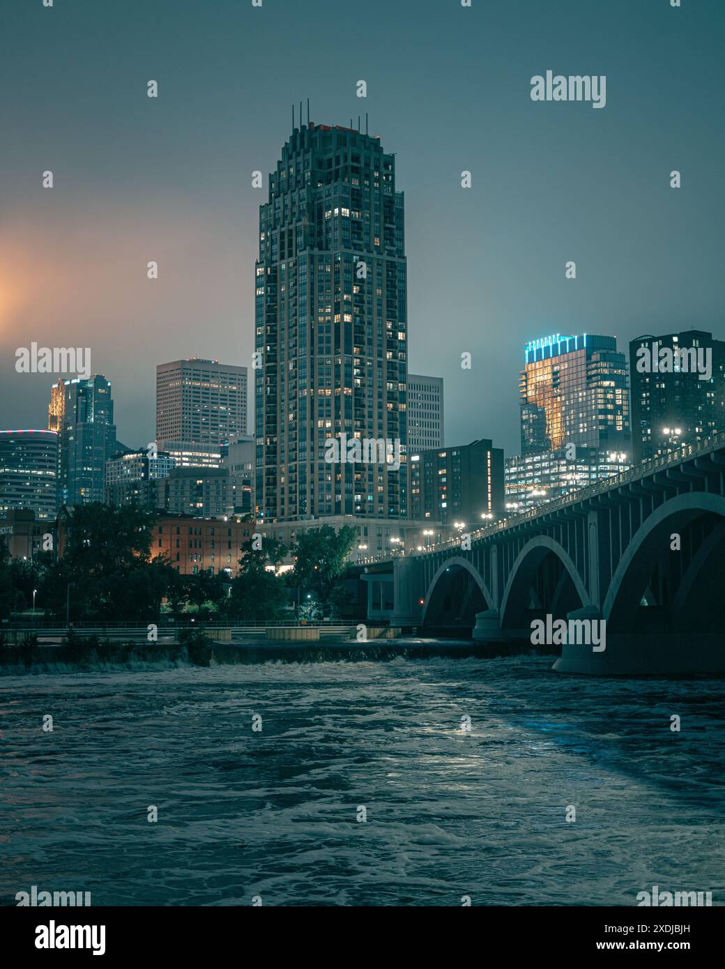 The Minneapolis skyline and Mississippi River at night in Minneapolis ...