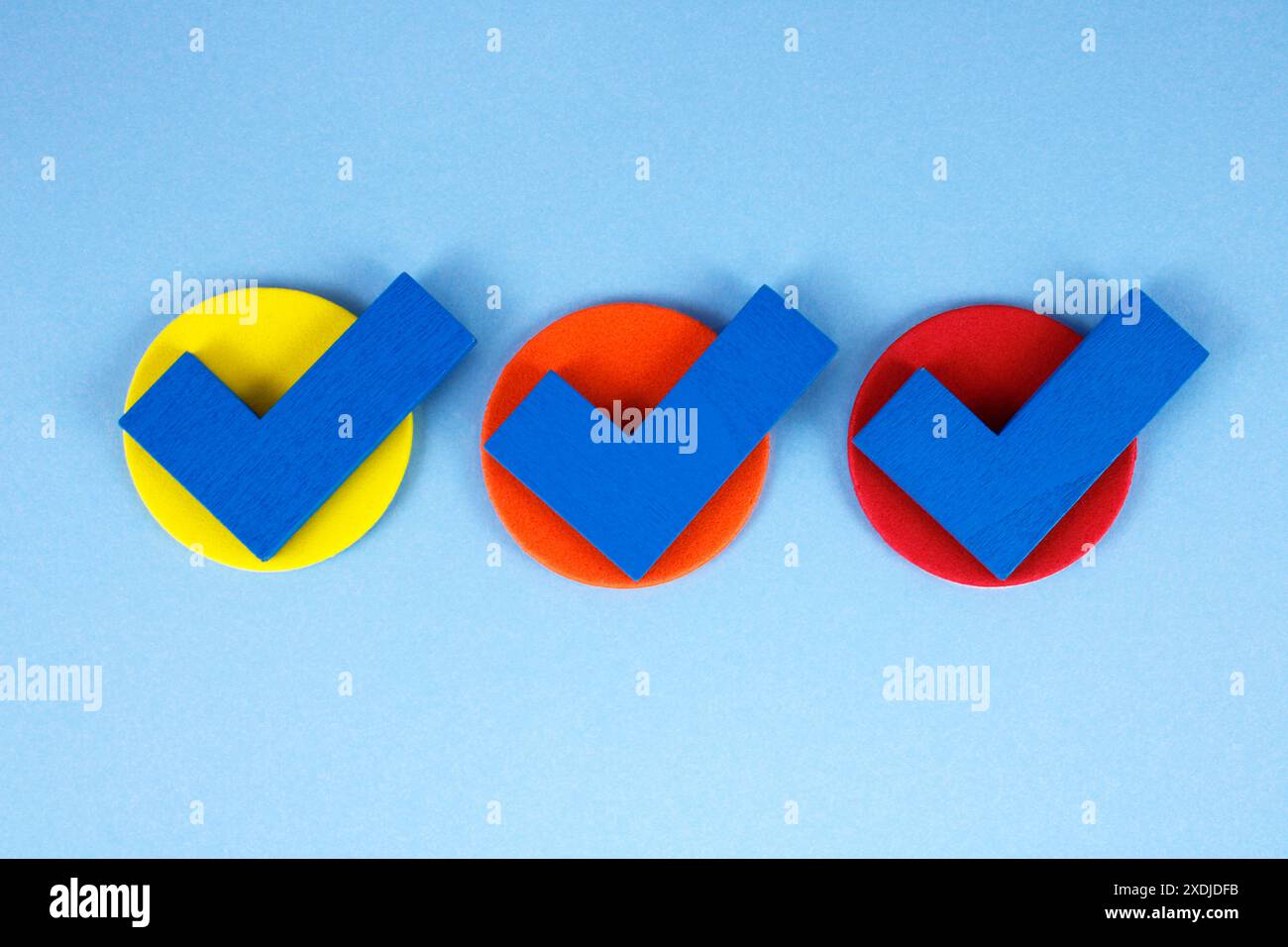 Check sign selecting three color options Stock Photo - Alamy