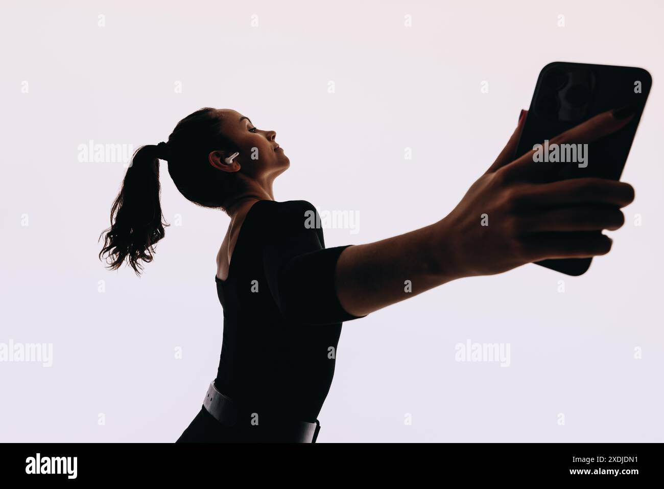 Female dancer performs dynamic dance moves with expressive body ...