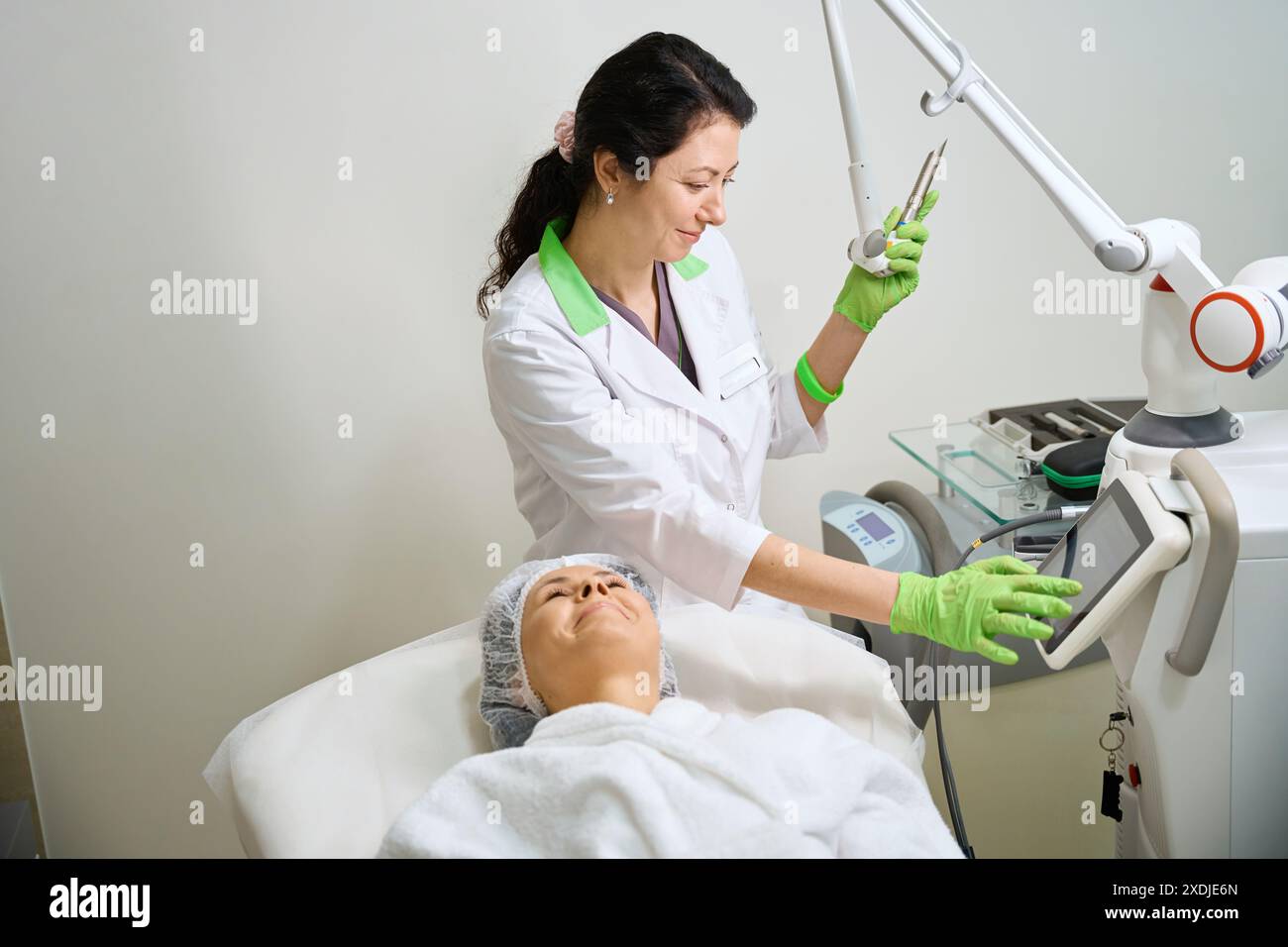 Cosmetologist using special device hi-res stock photography and images ...
