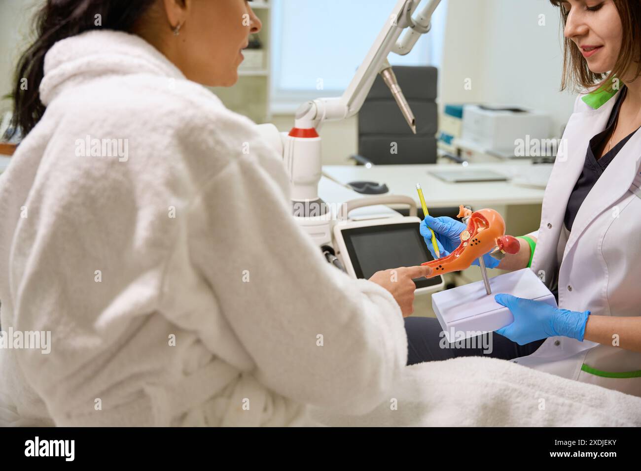 Specialist consults patient before procedure for treating walls of ...