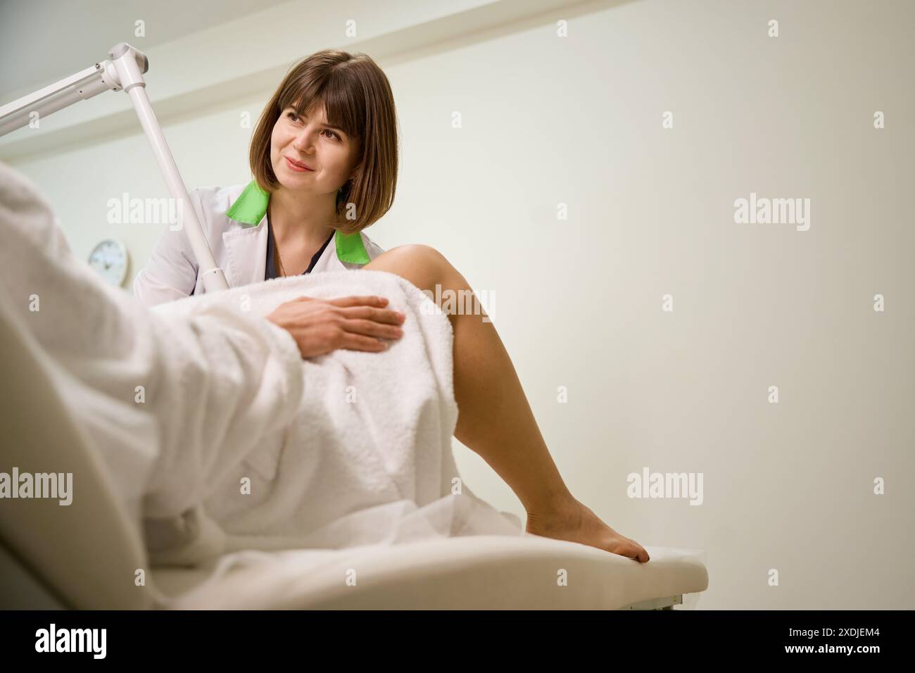 Female gynecologist performs laser treatment procedure on vaginal walls ...