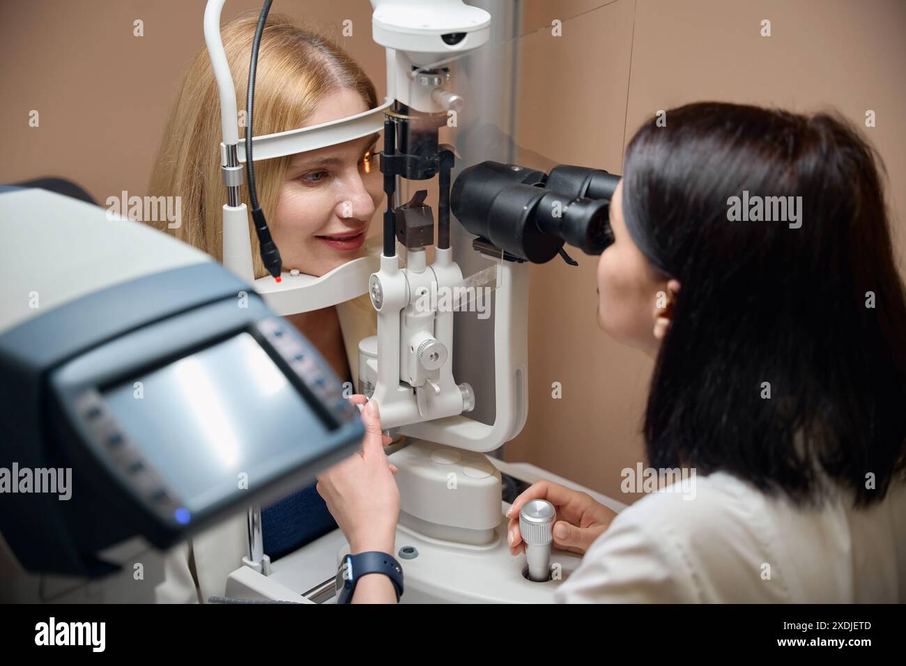 Female ophthalmologist performs vision hi-res stock photography and ...