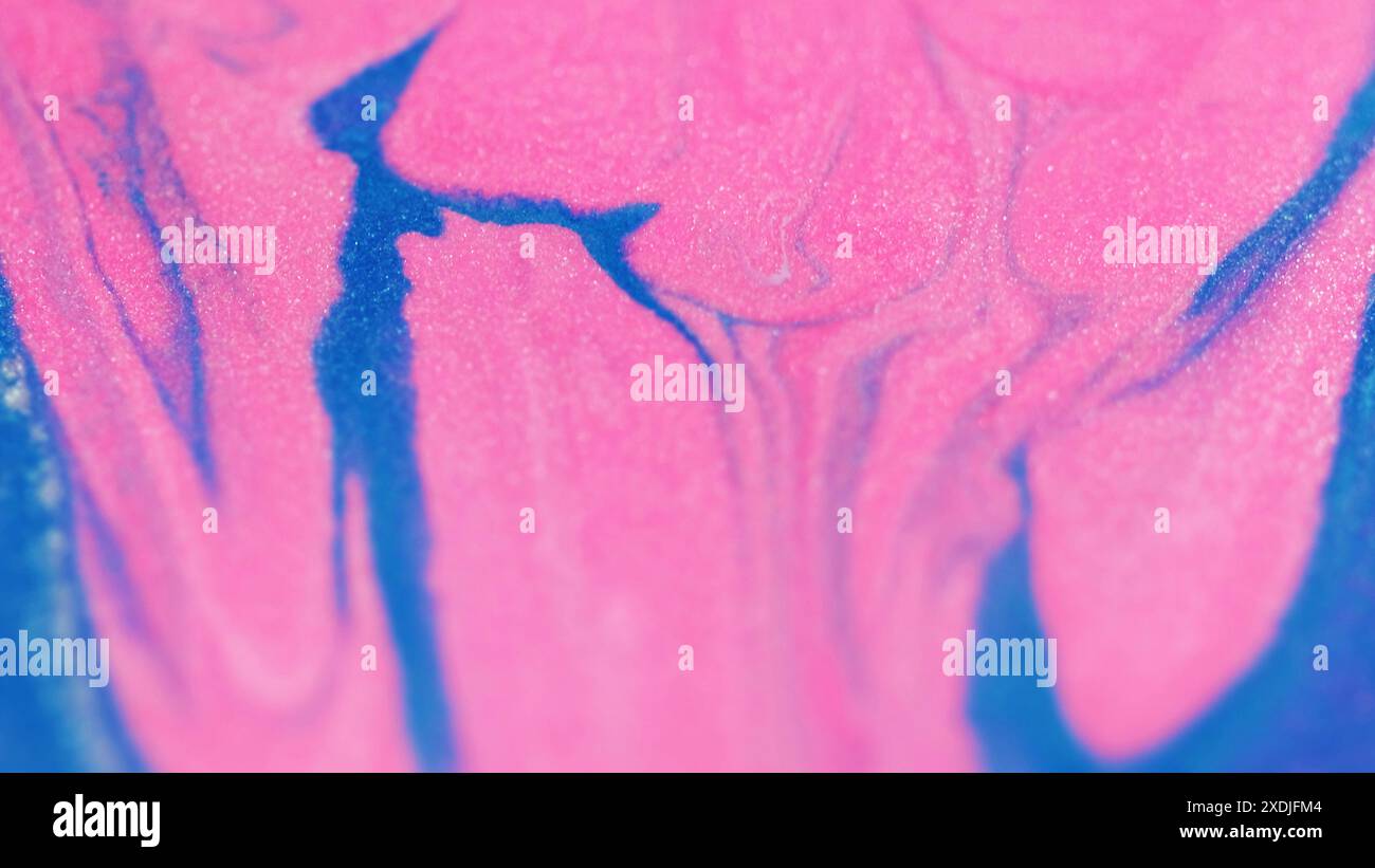 Glitter paint spill. Shimmering liquid. Defocused pink blue color shiny ...