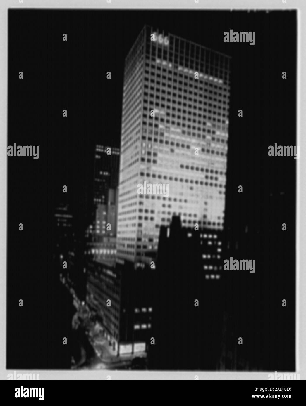 Tishman building, 666 5th Ave., New York City. Night view of building ...