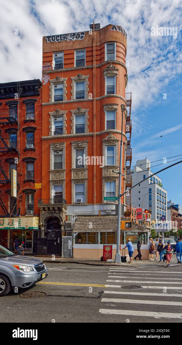 Ornate terra cotta spandrels and window surrounds grace this red-brick ...