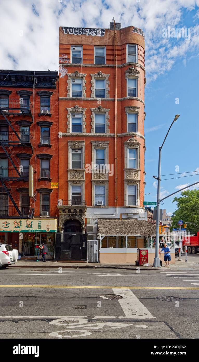 Ornate terra cotta spandrels and window surrounds grace this red-brick ...